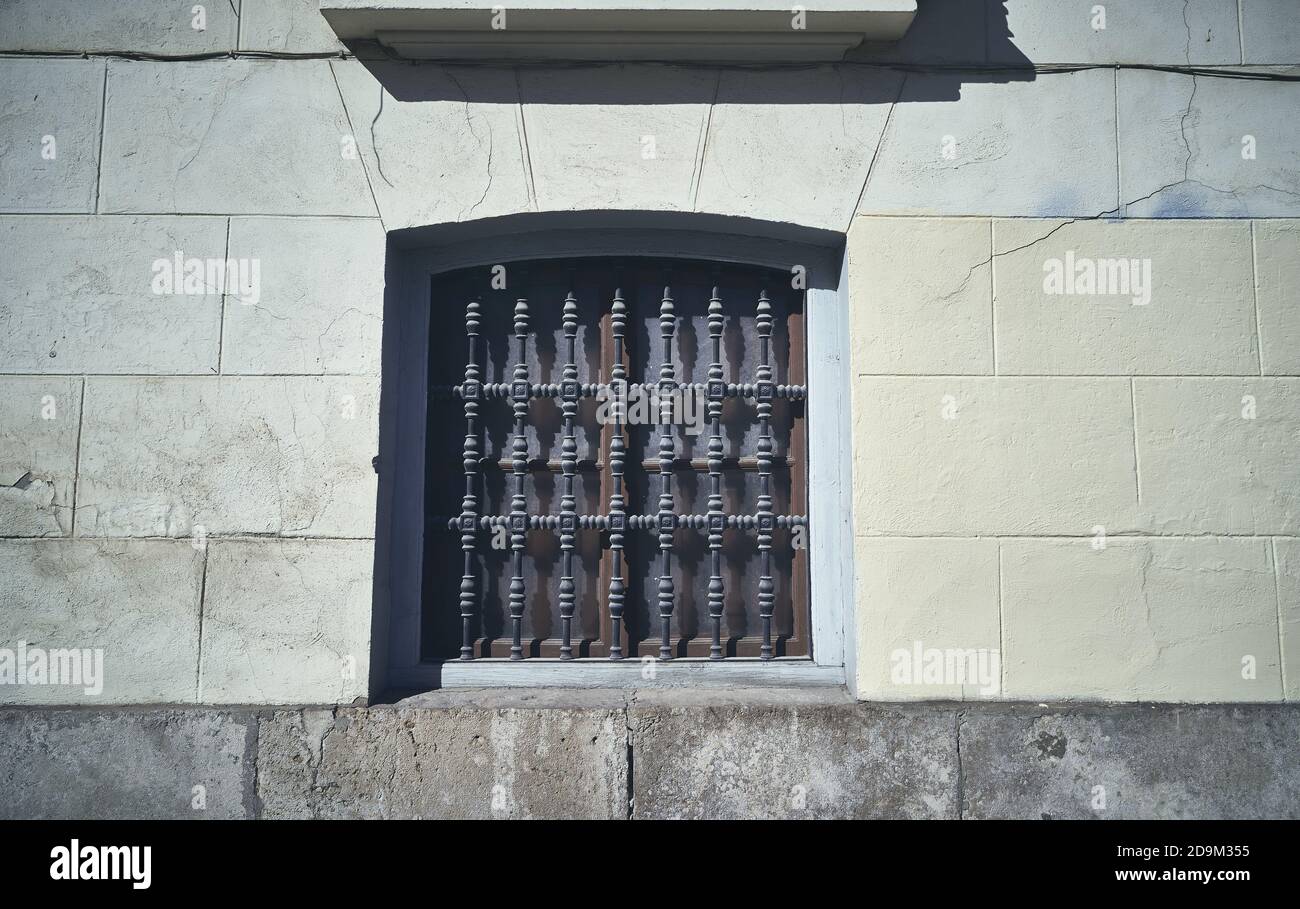 Metal window on the wall of an old building Stock Photo - Alamy