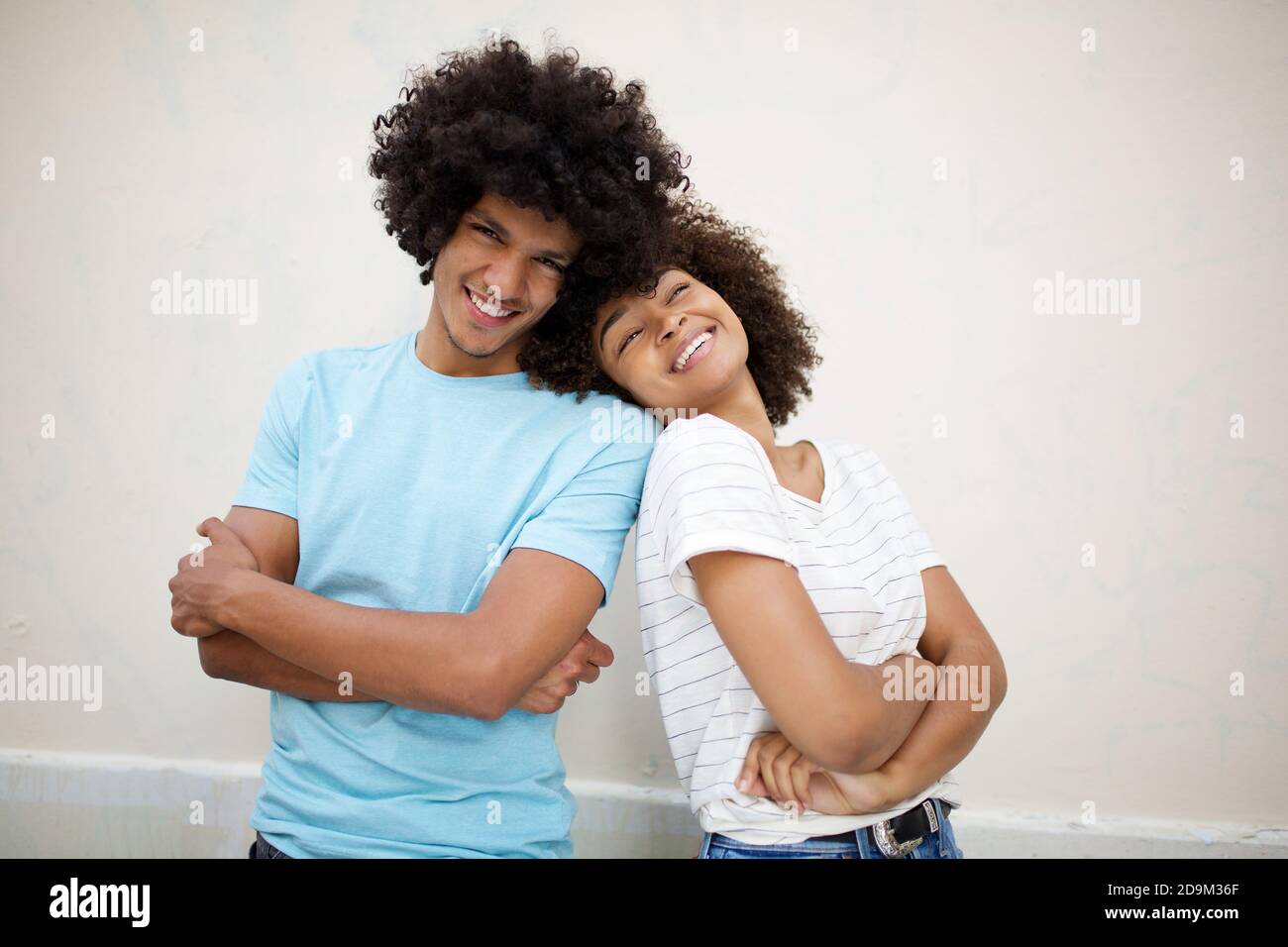 Portrait two cool young afro friends standing by white wall Stock Photo ...