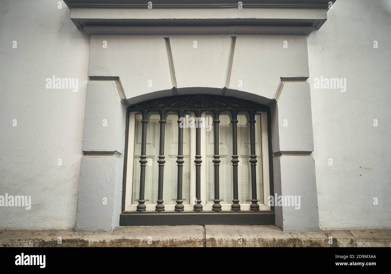 Metal window on the wall of an old building Stock Photo - Alamy