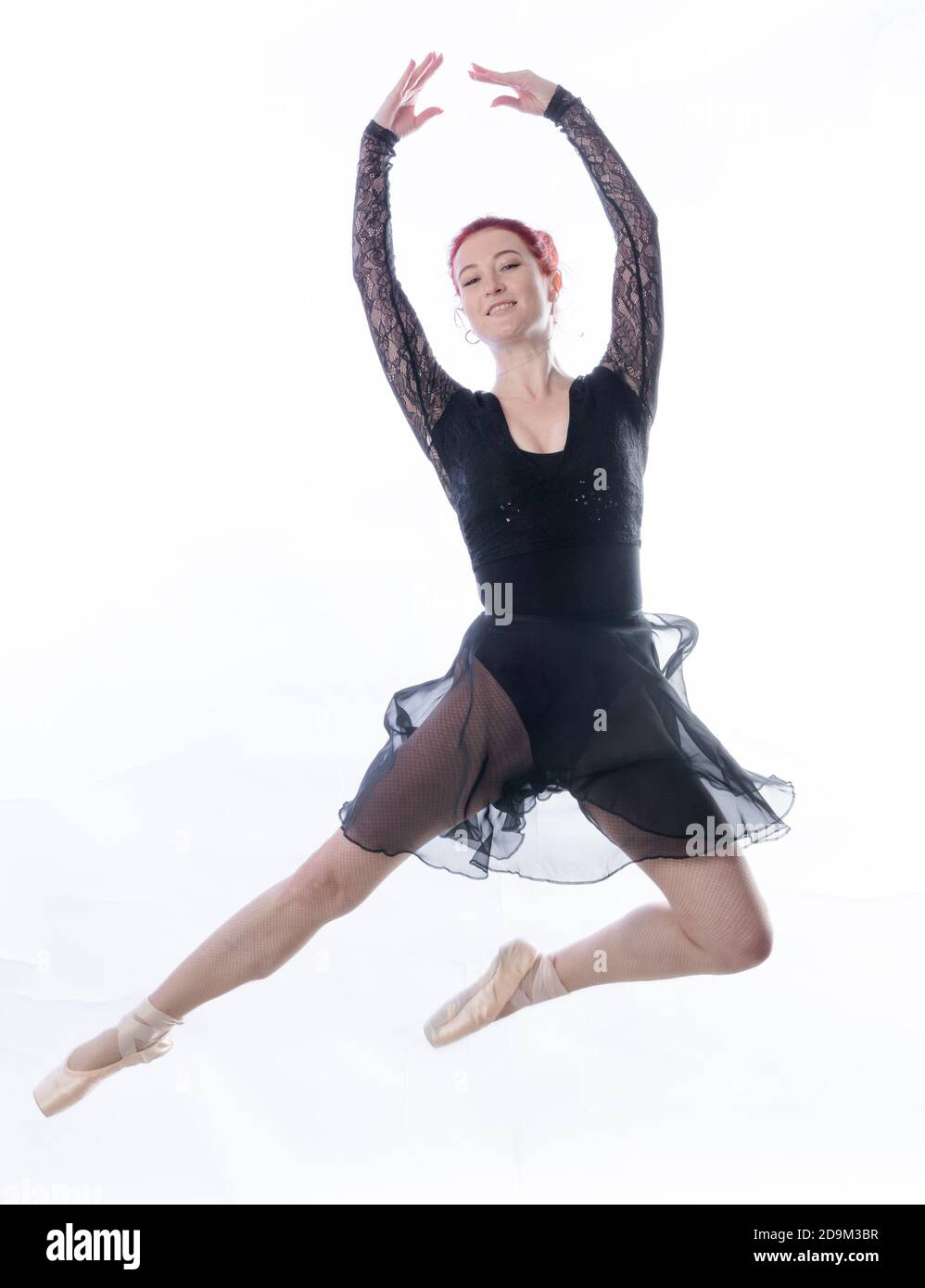 Beautiful dancer studio portrait stepping on white background Stock ...
