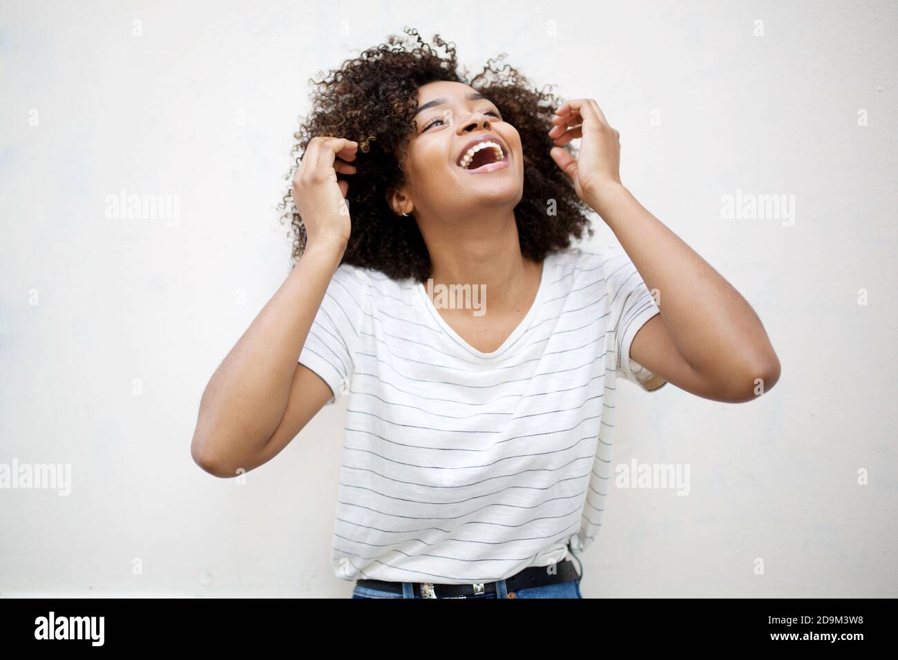 Close up portrait cheerful young african american woman laughing with ...