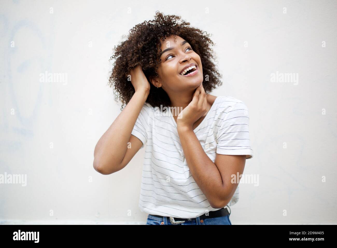 Close up portrait cheerful young african american woman laughing with ...