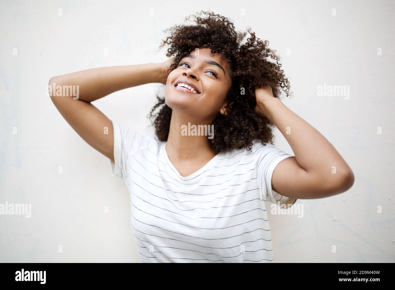 Close up portrait happy young african american woman laughing with ...