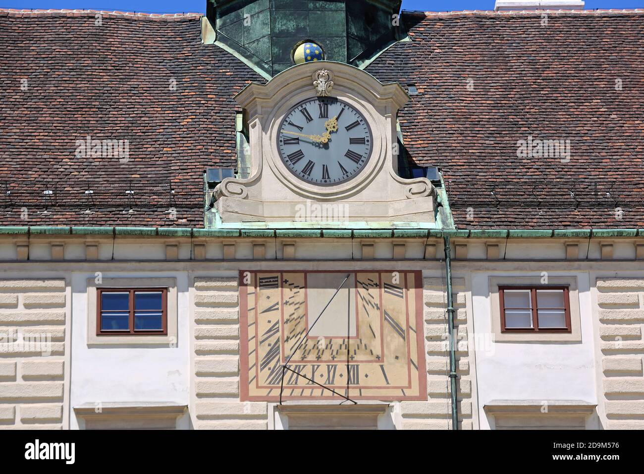 Public Clock and Sundial Time at Building in Vienna Stock Photo - Alamy