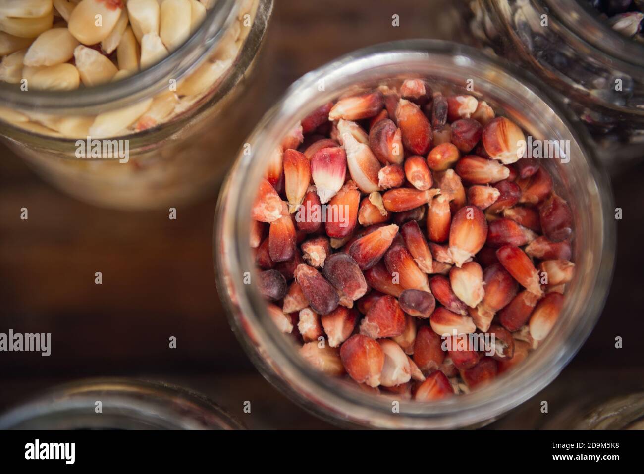 Top view of glass jars filled with colorful dried corn kernels Stock ...