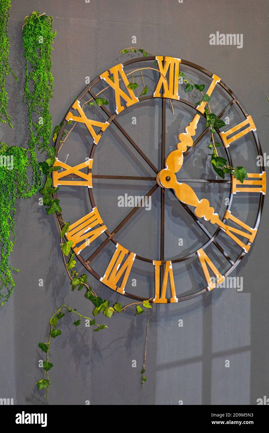 Big Roman Clock at Wall Home Decor Stock Photo - Alamy