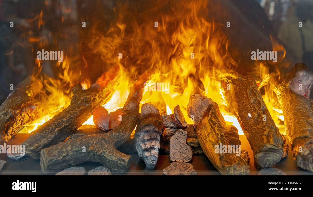 Fire Smoke Effects Artificial Wood Logs in Fireplace Stock Photo - Alamy