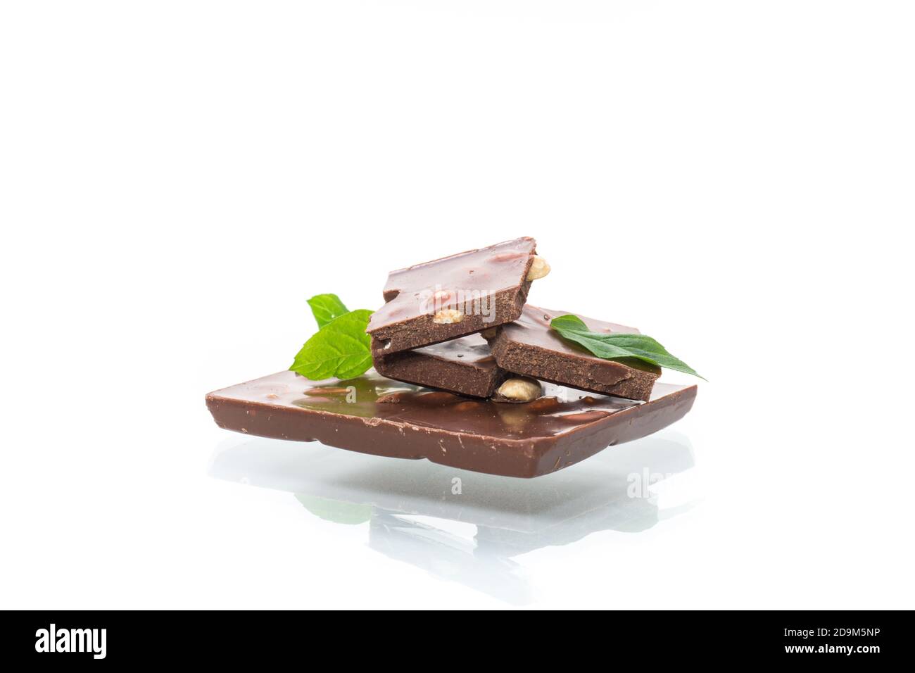 sweet dark chocolate with nuts on a white background Stock Photo - Alamy