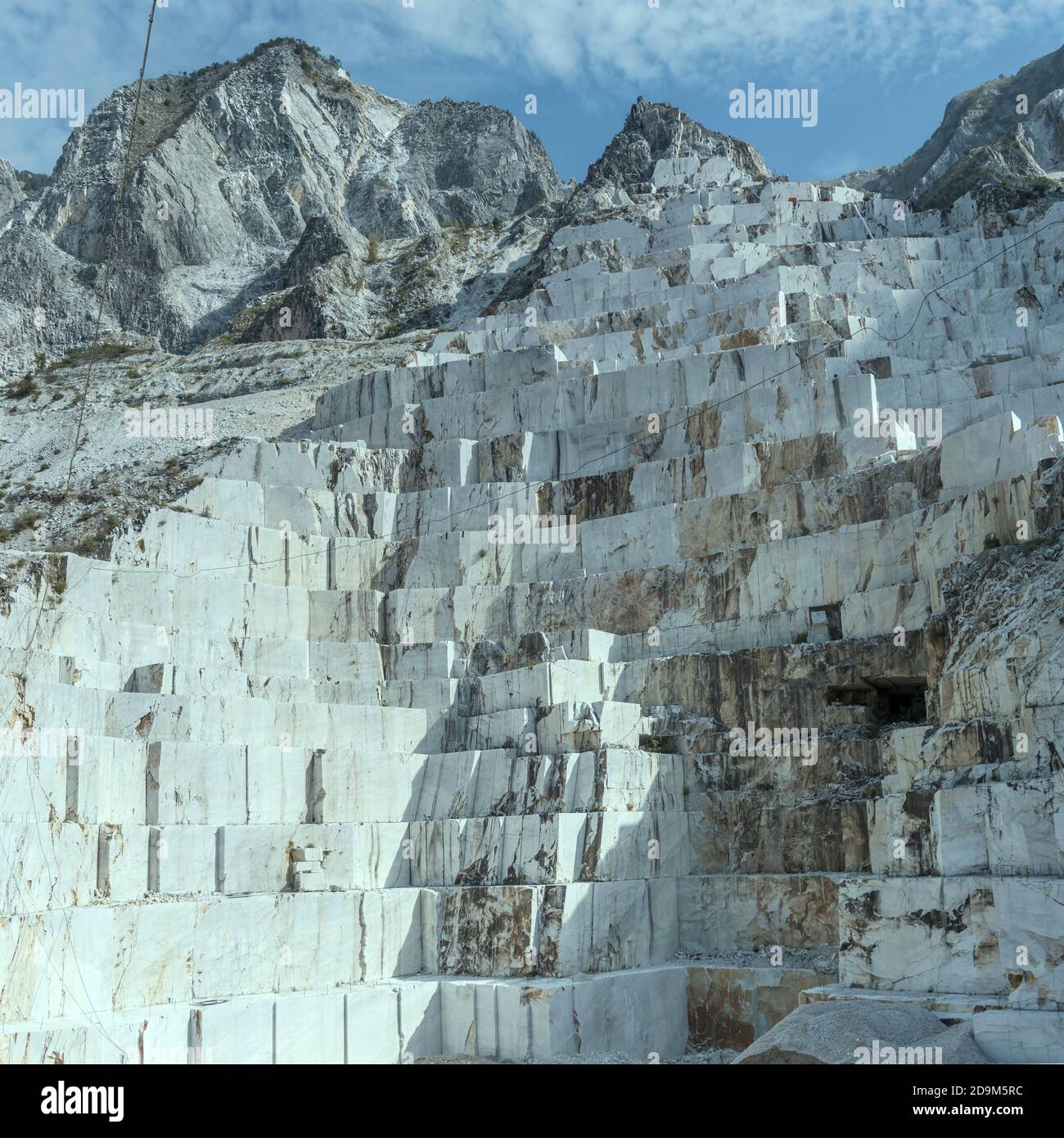 landscape with vertical terraced squared faces of Carrara white marble ...