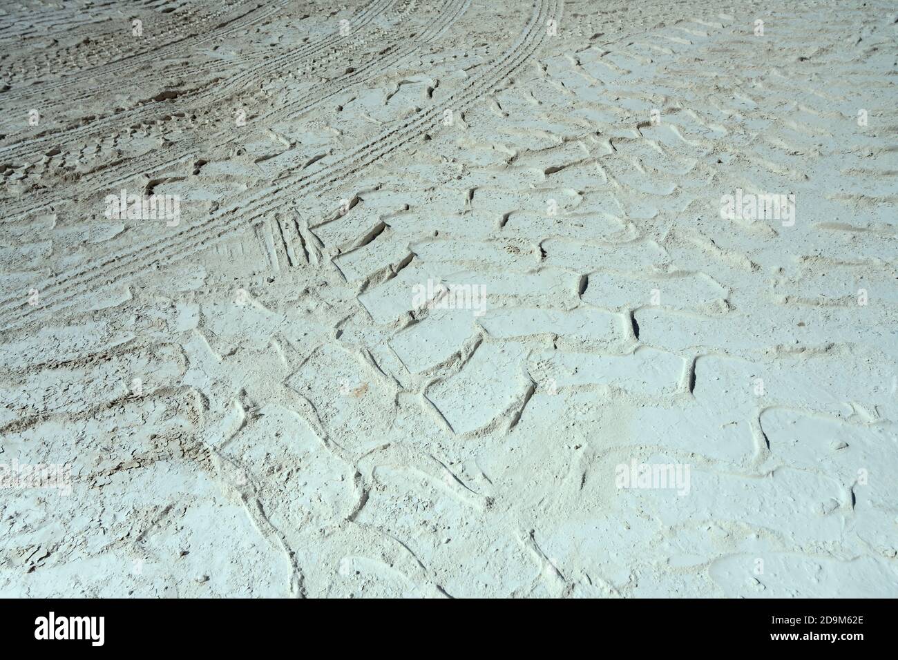 detail of tyre tracks on white powder at marble quarry, shot near ...