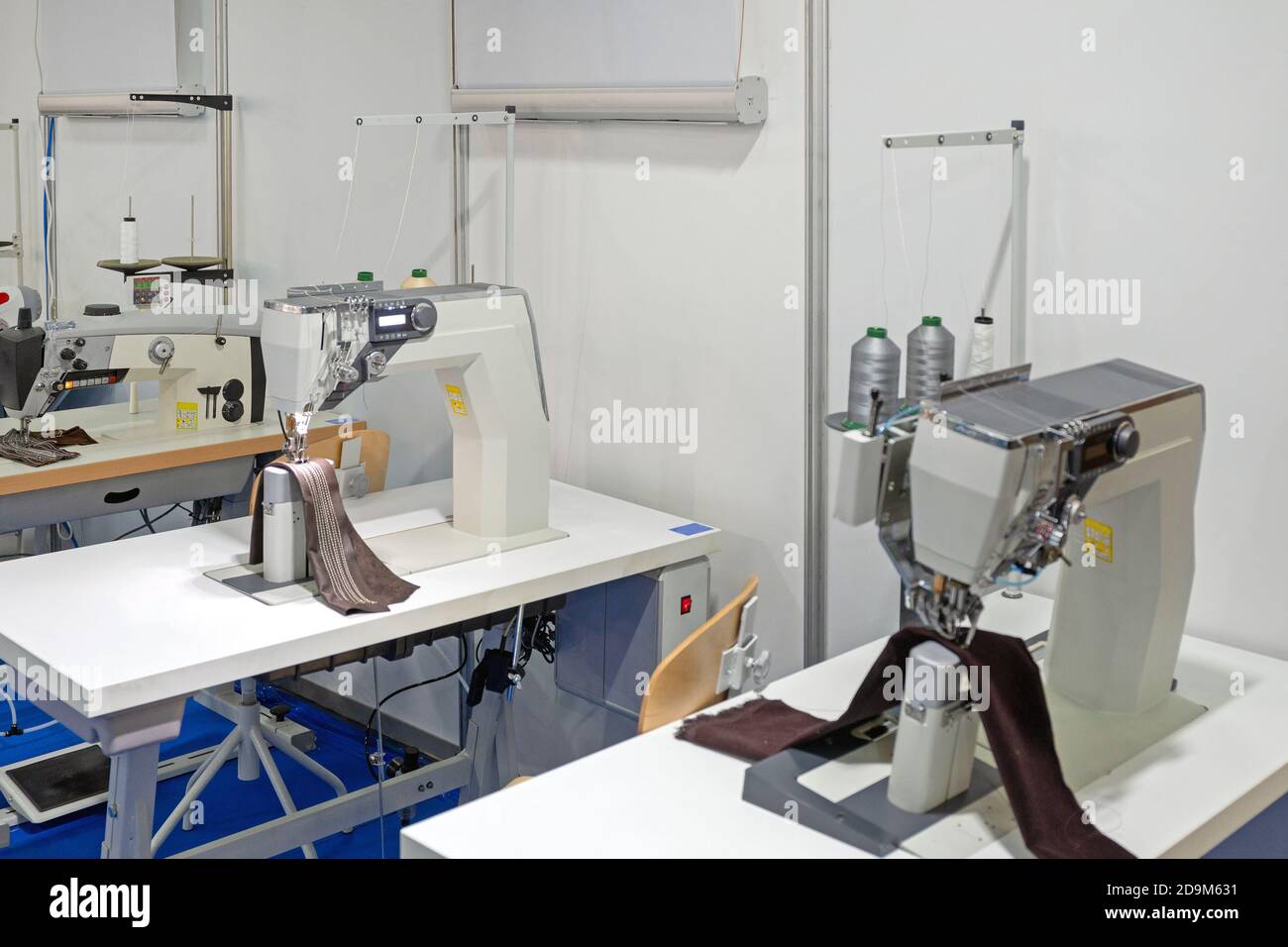 Sewing Machines in Garment Clothing Work Shop Stock Photo - Alamy