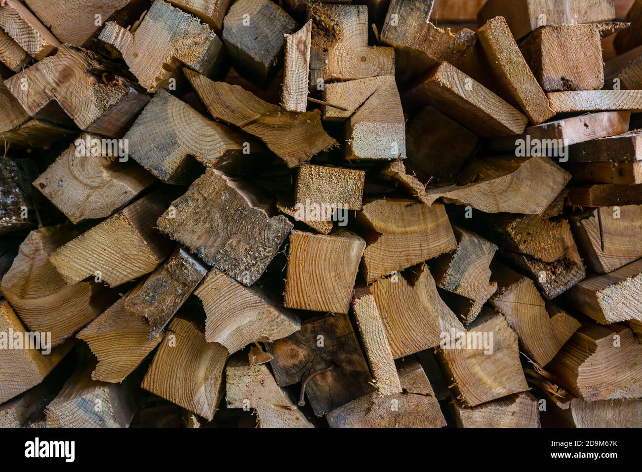Firewood of different sizes is yellow in color Stock Photo - Alamy