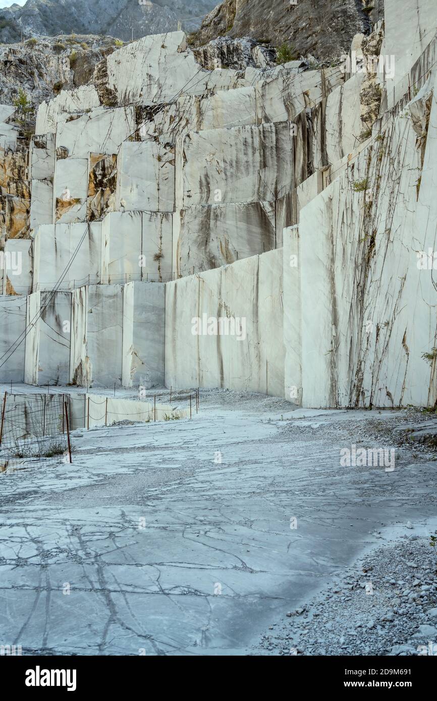 landscape with terraced carving with vertical face at marble quarry ...