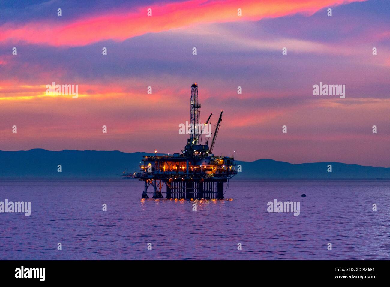 Vibrant sunset over offshore petroleum platform, known as Facility ...