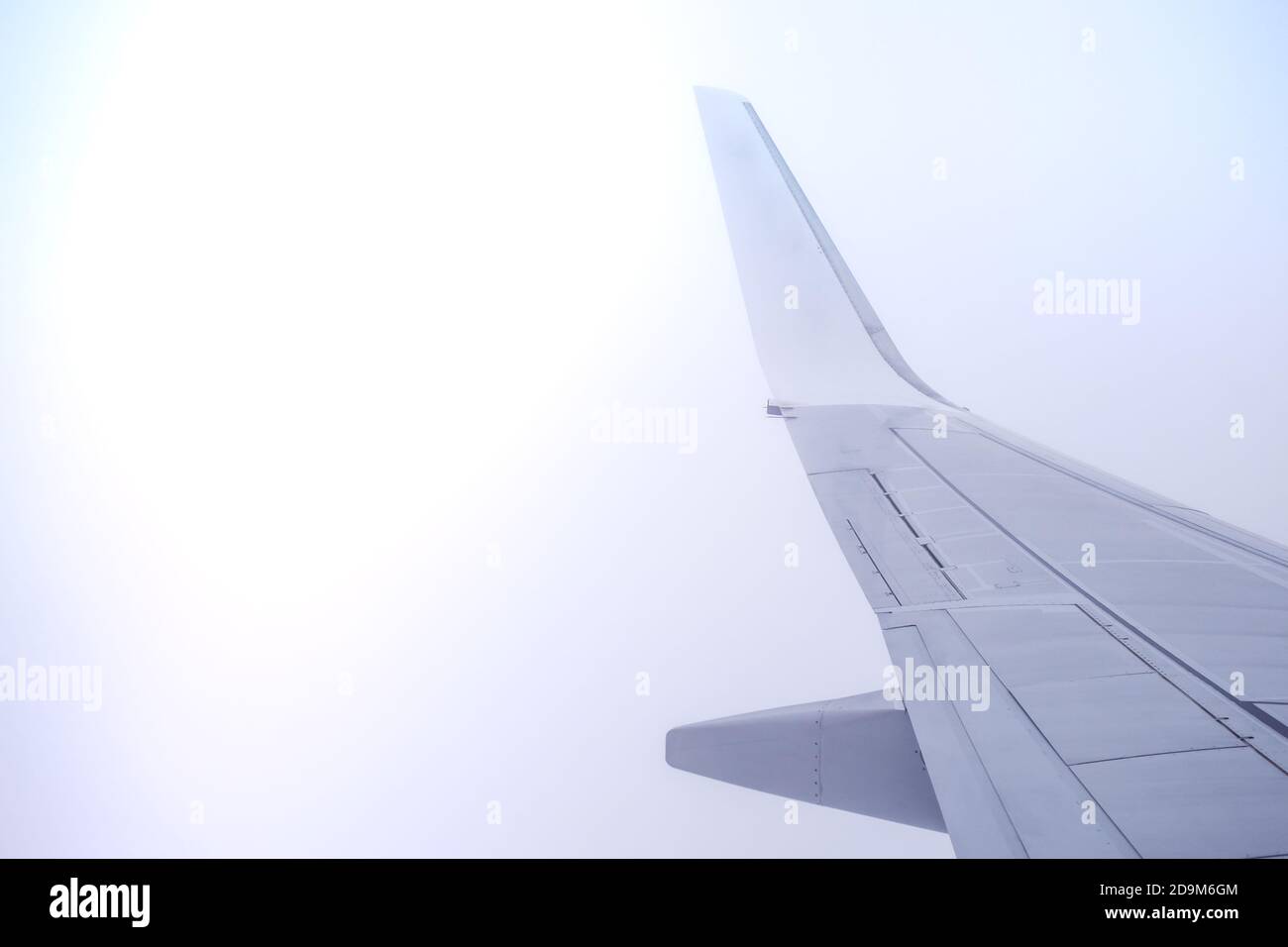 airplane wing in clouds with fog Stock Photo - Alamy
