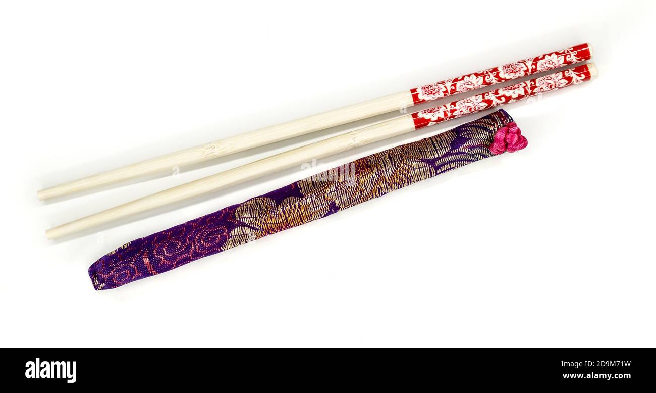 Wooden chopsticks with cloth cover on white background Stock Photo - Alamy