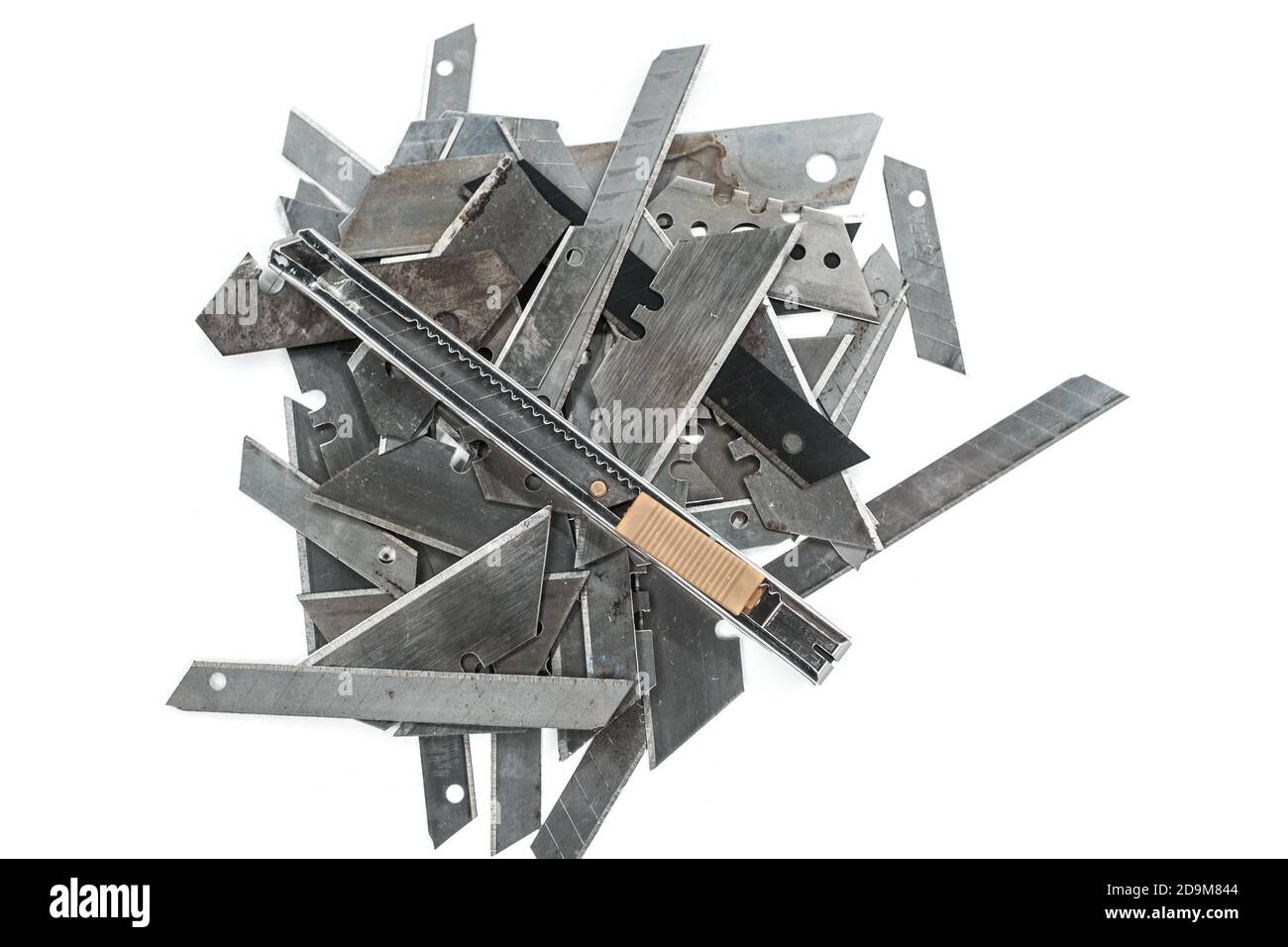 old used rusty cutter with used blades Stock Photo - Alamy