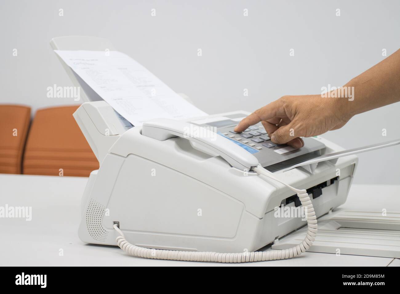 hand man are using a fax machine in the office, equipment for data ...