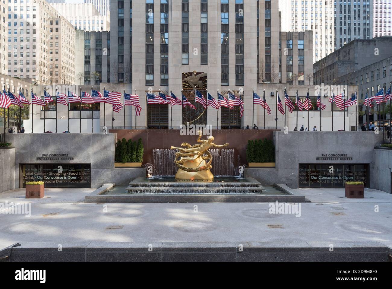 View of the Rockefeller Center with American flags Stock Photo - Alamy