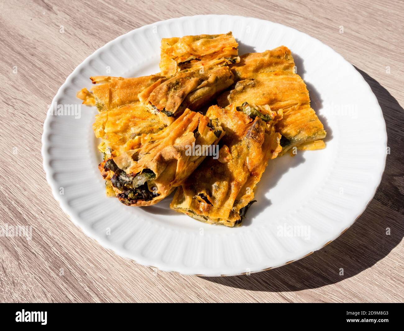 Turkish traditional borek with spinach and cheese Stock Photo - Alamy