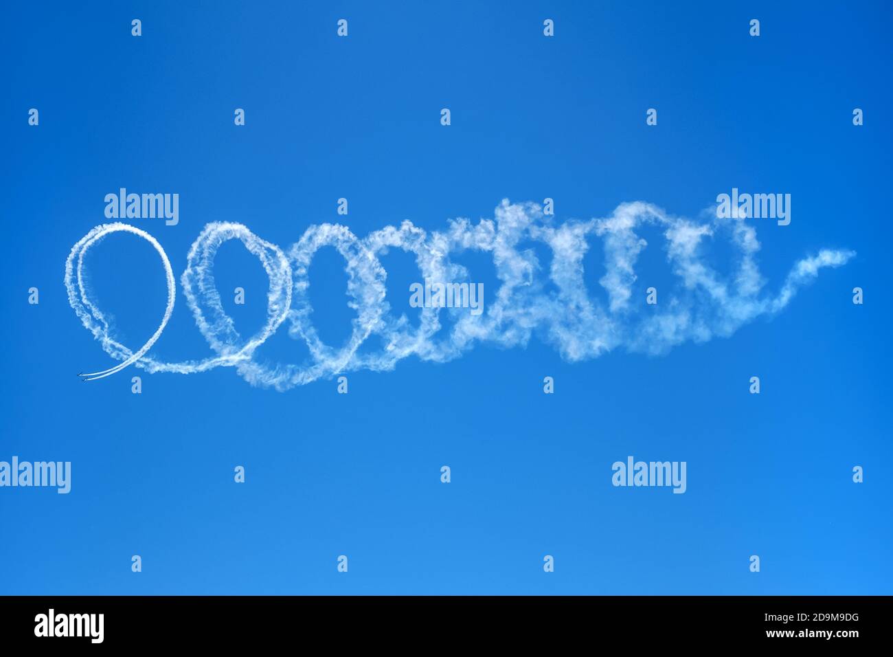 Abstract skywriting design with spiraling circles of vapor Stock Photo ...