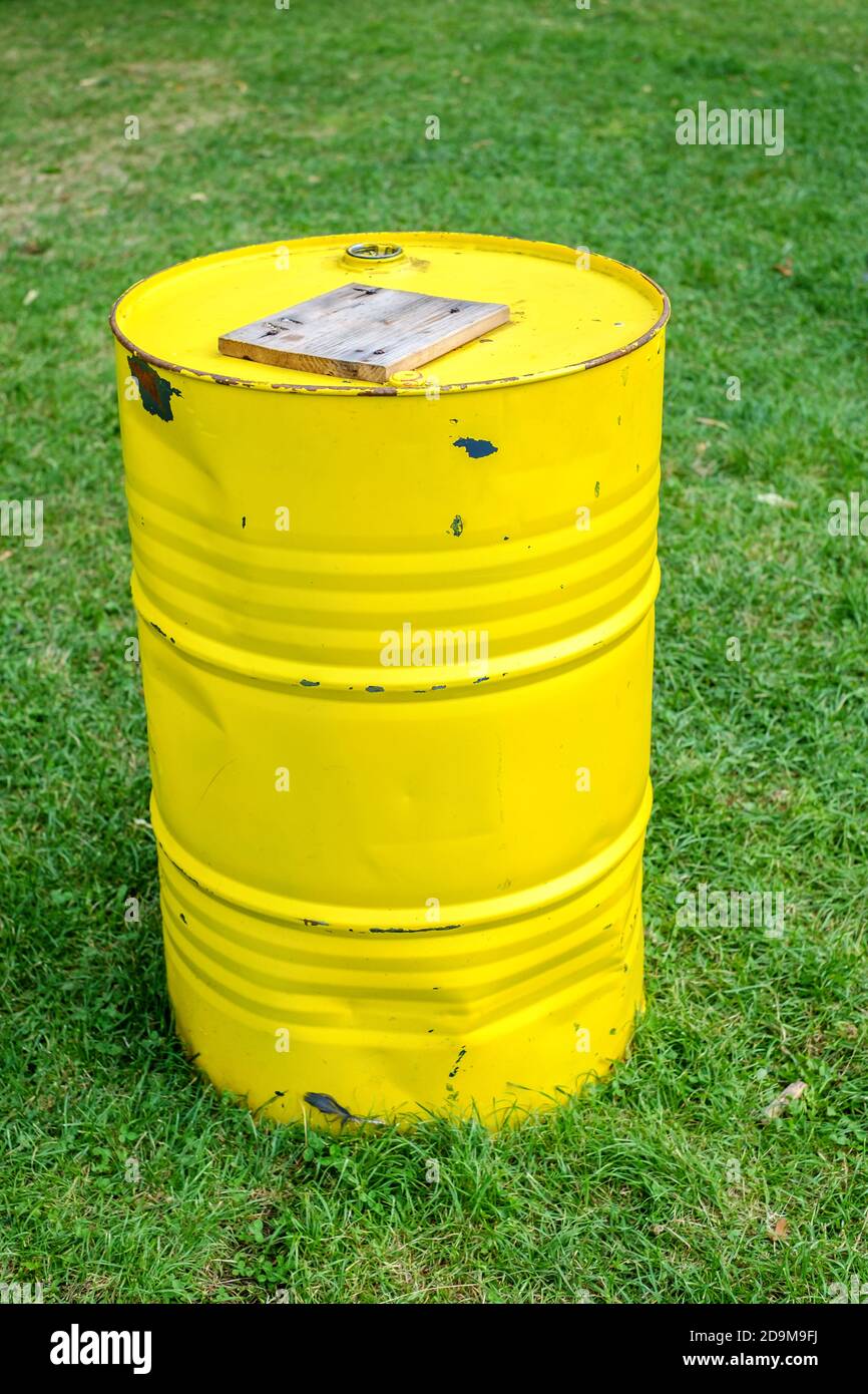 yellow barrel in the grass Stock Photo - Alamy