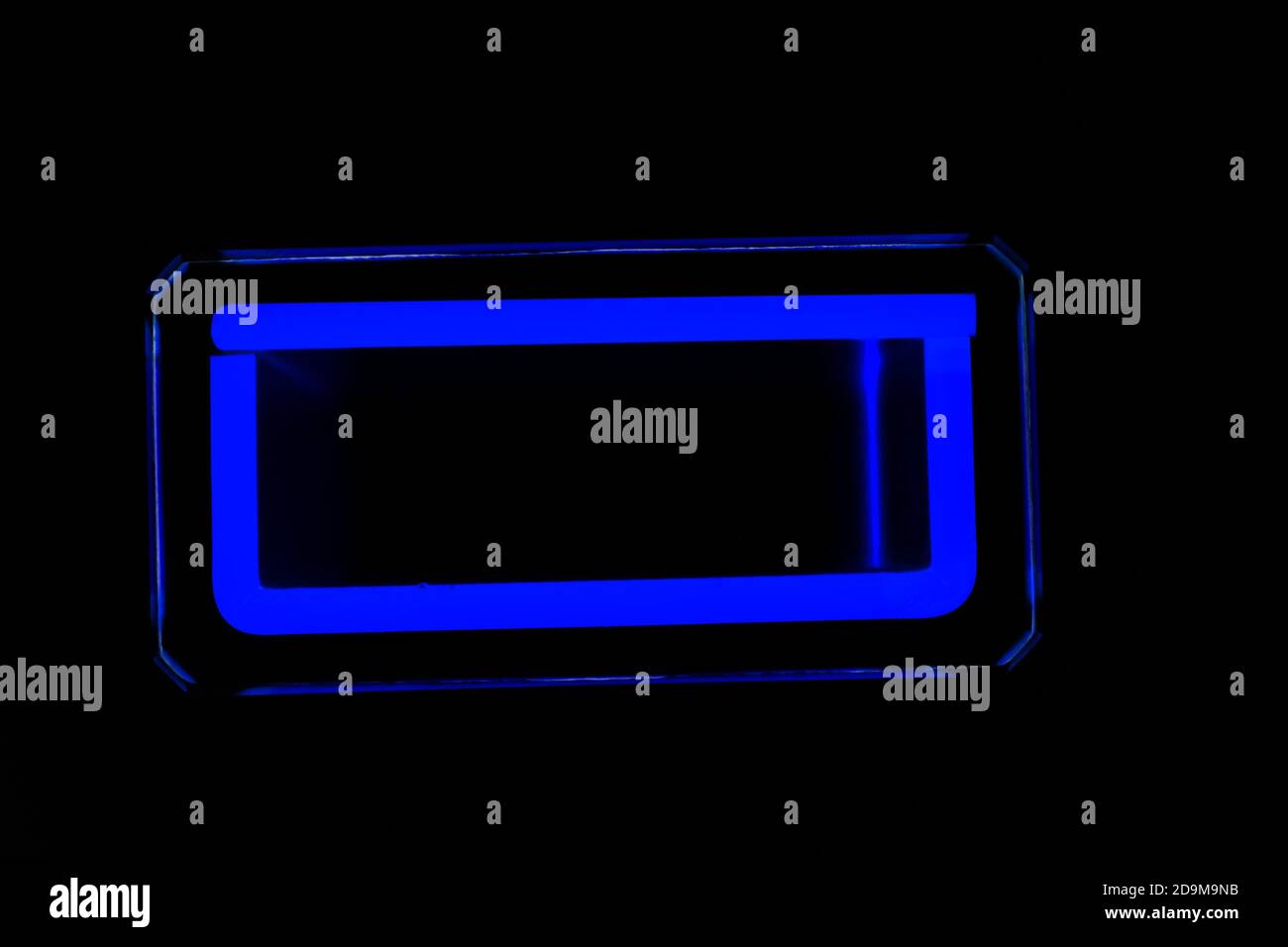 blue neon shape on black background Stock Photo - Alamy