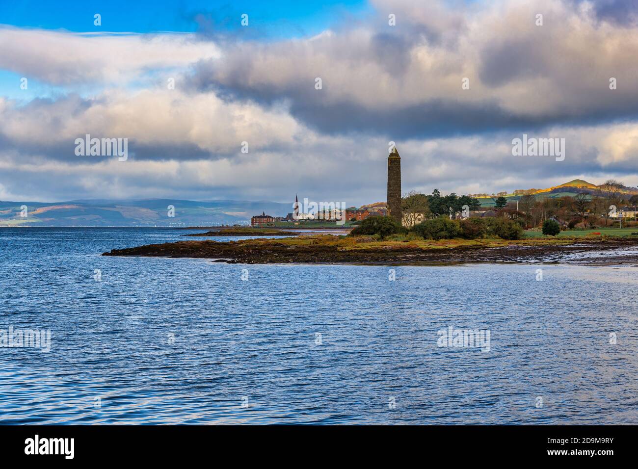 Largs foreshore looking past the Pencil Monument Stock Photo - Alamy