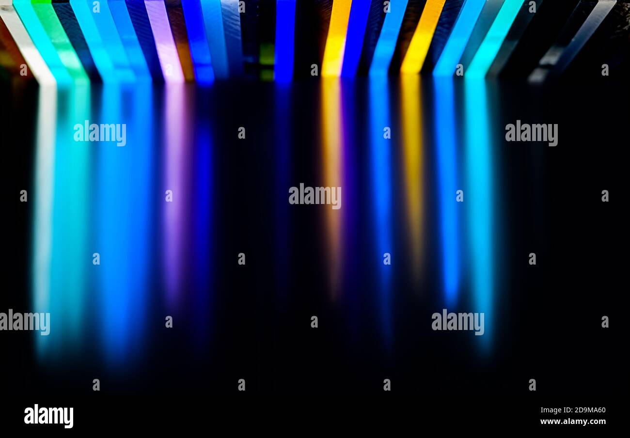 light through Stack of different colours Cast Acrylic Sheet on black ...