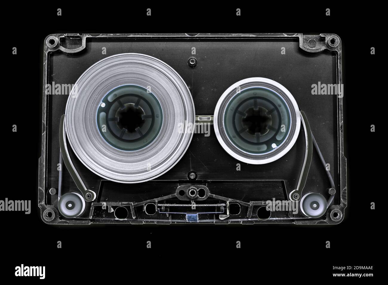 old audio cassette tape open on black Stock Photo - Alamy