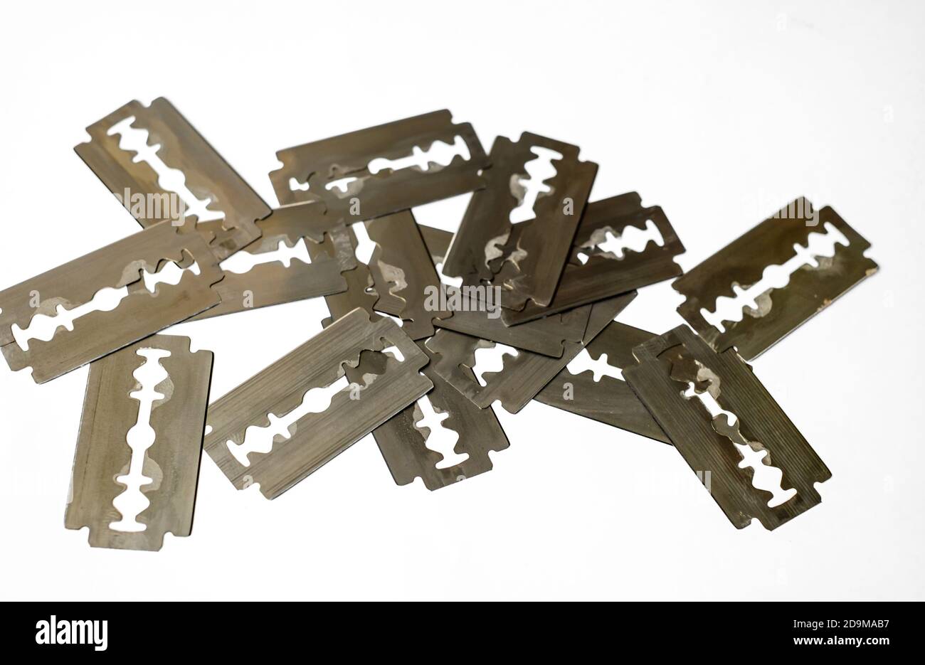 old razor shaving blade on white background Stock Photo - Alamy