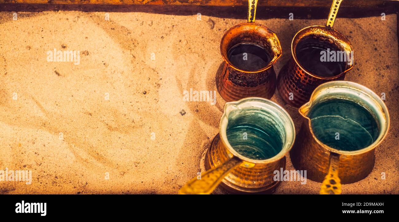 Turkish coffee made in traditional coffee pot on sand Stock Photo - Alamy