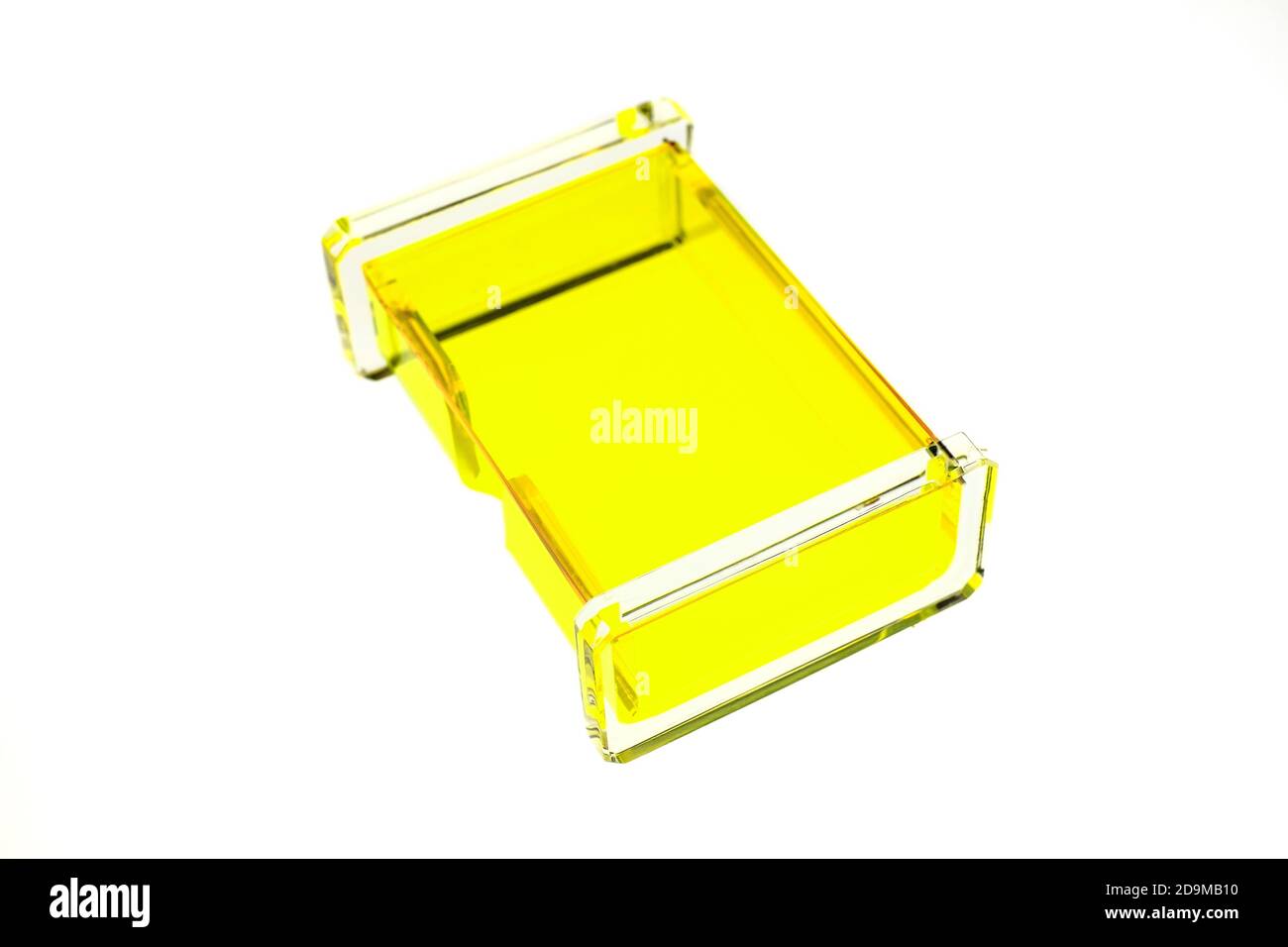 transparent yellow plastic box on white background Stock Photo - Alamy