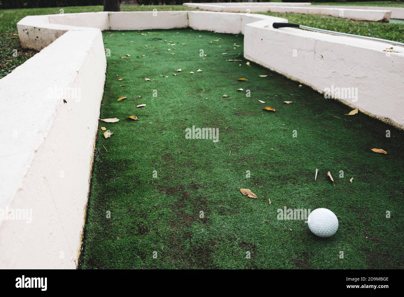 White ball at golf course with distance to target hole. Playing mini ...