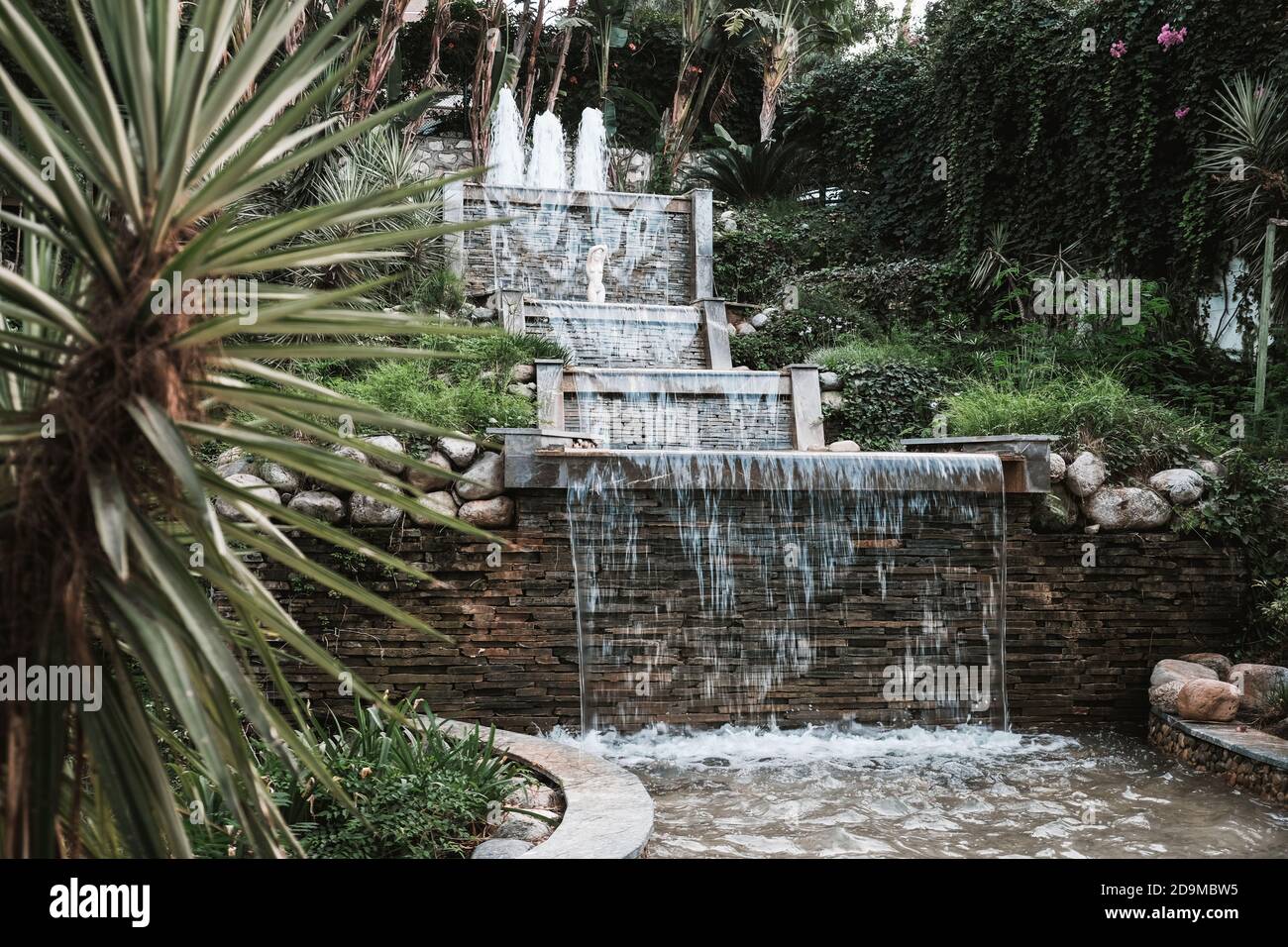Belek, Turkey - October 2020: Beautiful waterfall with statue on all ...