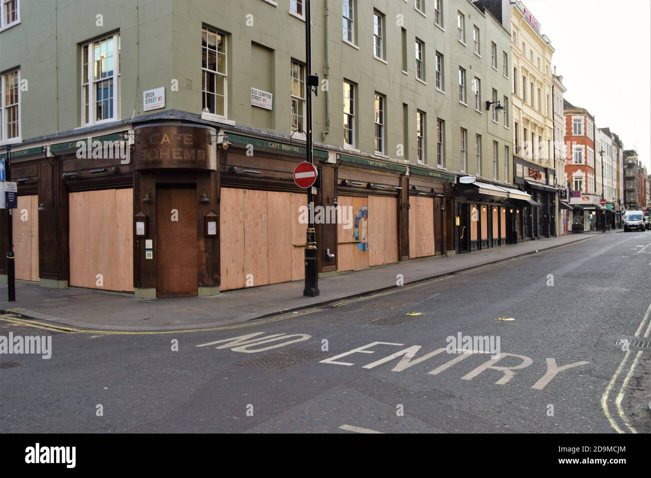 Closed and boarded up restaurants and bars on an empty Old Compton ...