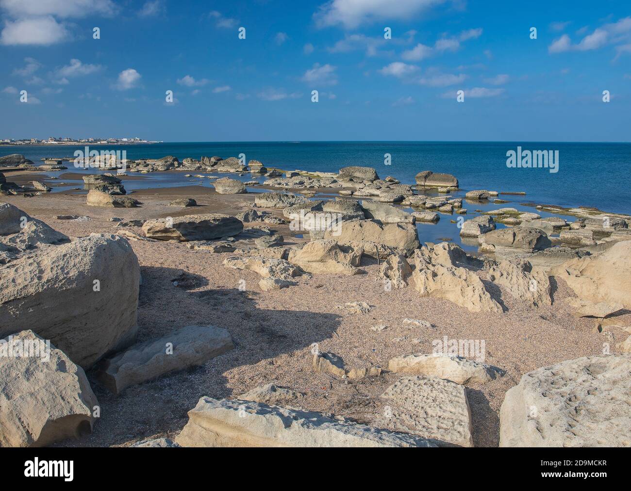 Boulders of rocks lying on the coast after the shallowing of the sea ...