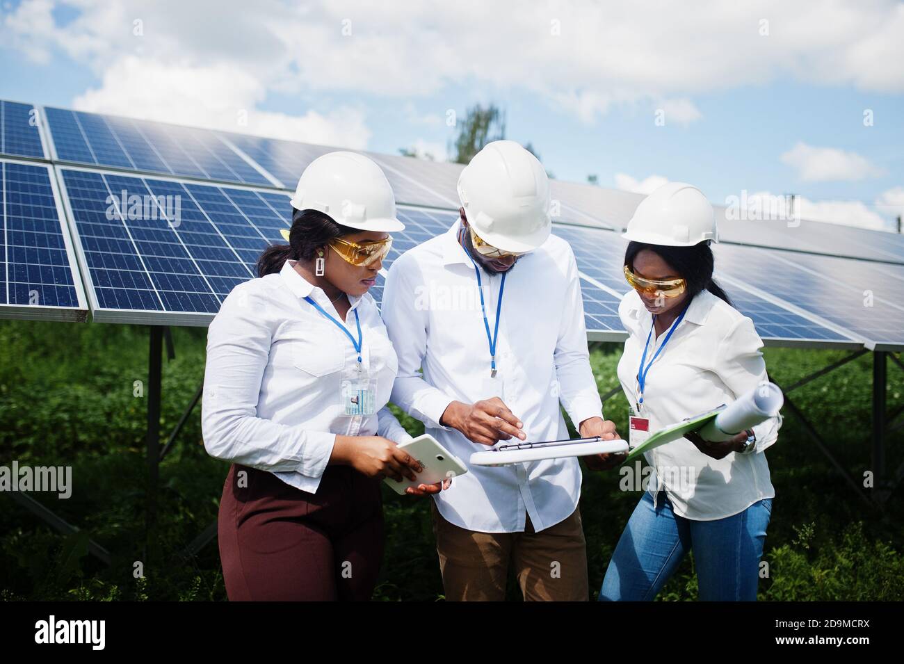 African american technician checks the maintenance of the solar panels ...