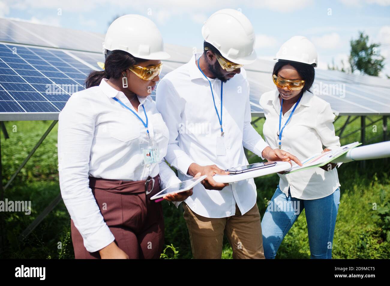 African american technician checks the maintenance of the solar panels ...