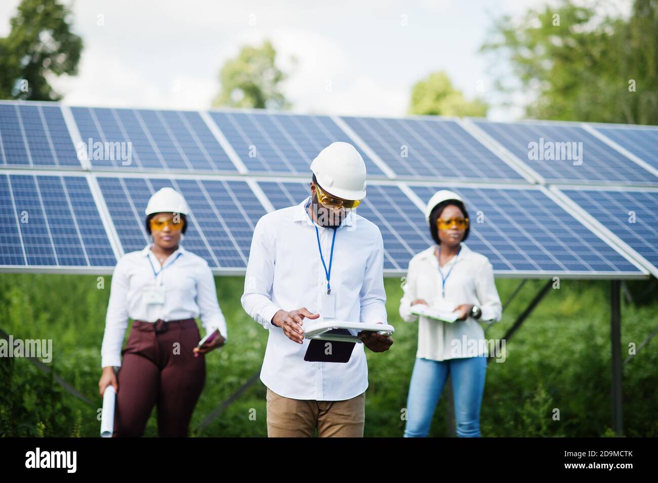 African american technician checks the maintenance of the solar panels ...