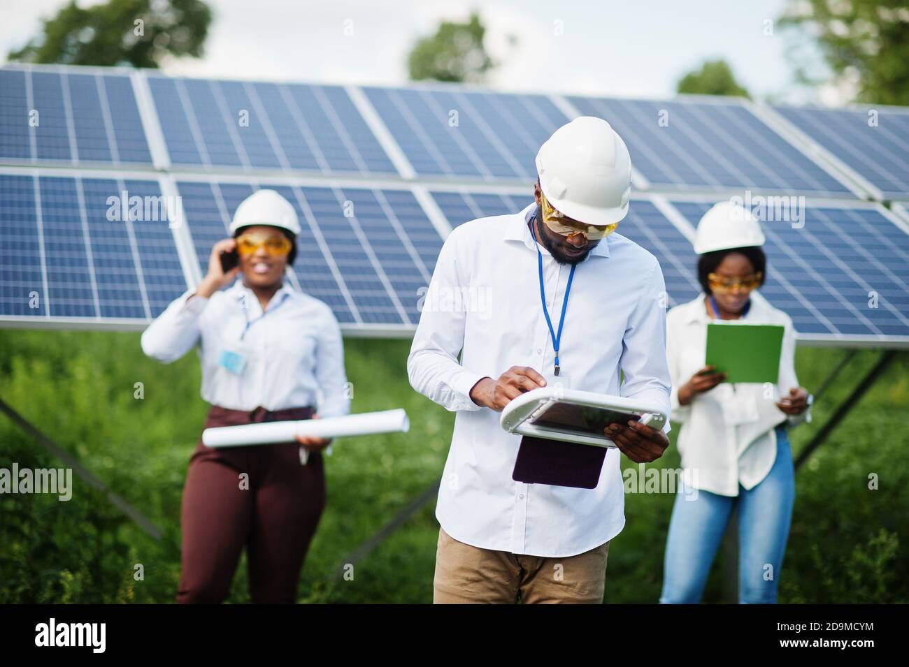 African american technician checks the maintenance of the solar panels ...