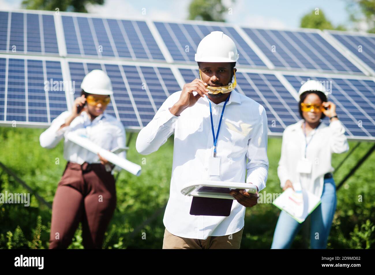African american technician checks the maintenance of the solar panels ...