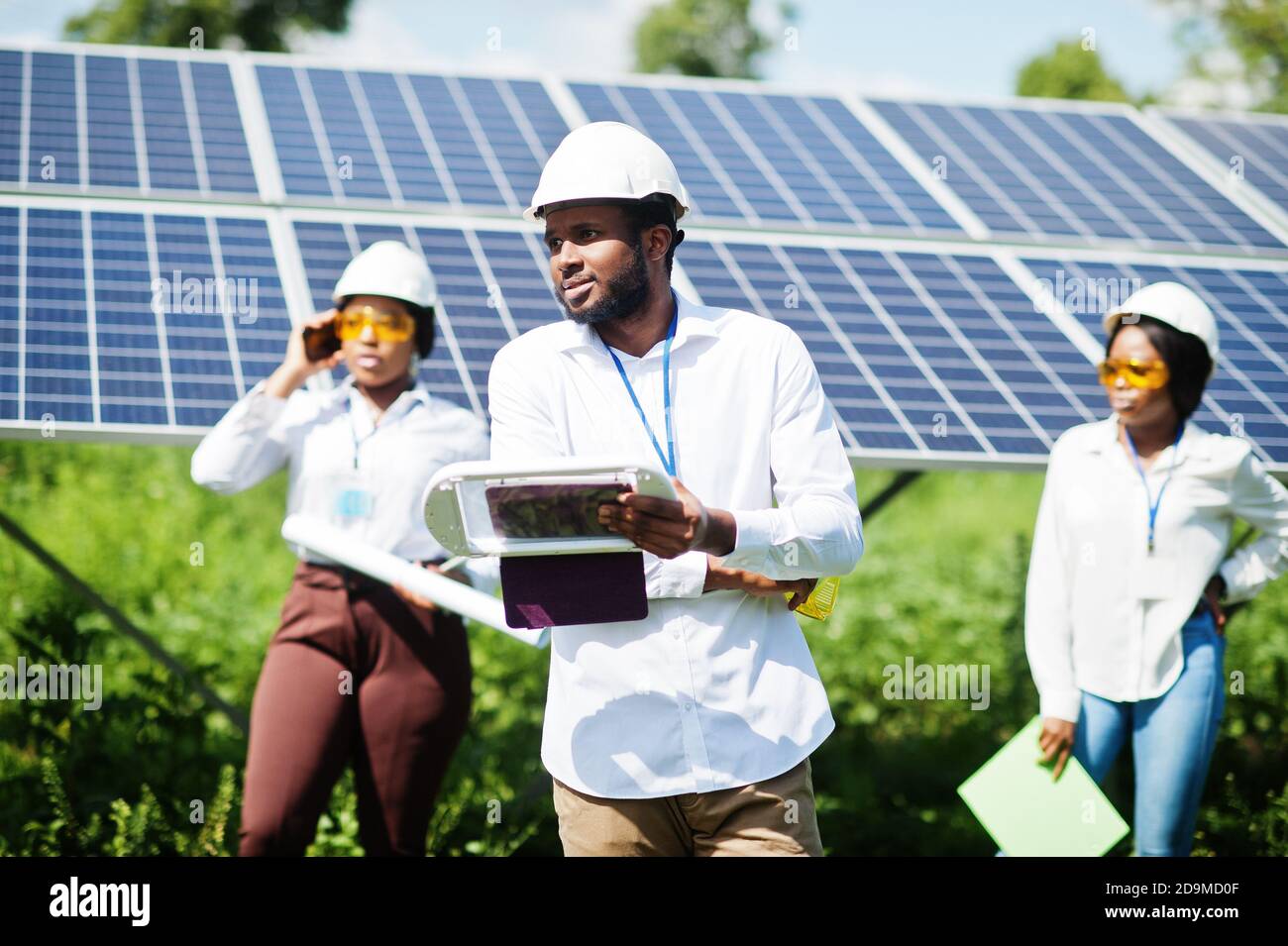 African american technician checks the maintenance of the solar panels ...
