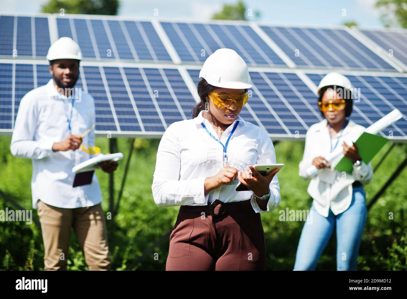 African american technician checks the maintenance of the solar panels ...