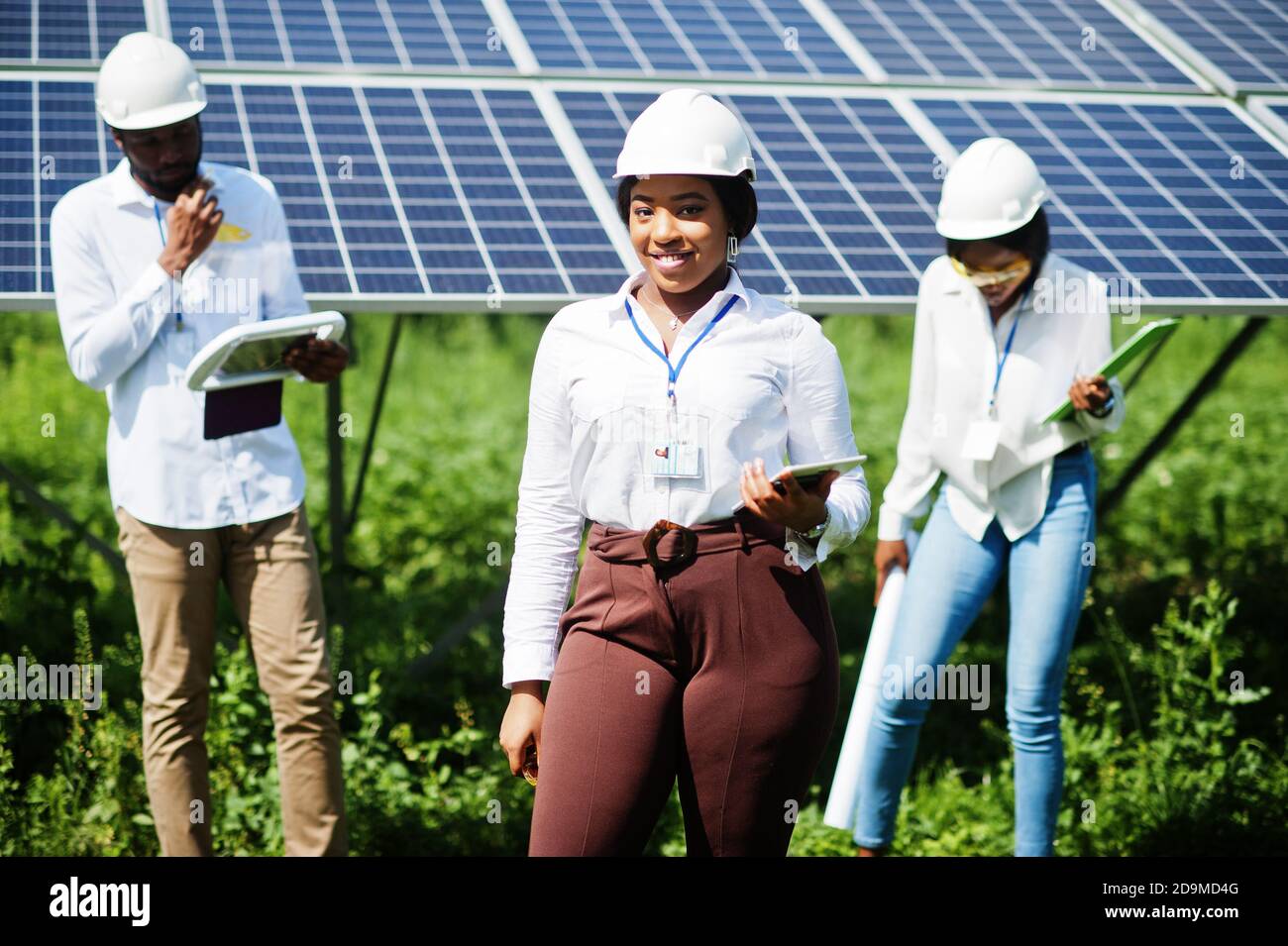 African american technician checks the maintenance of the solar panels ...