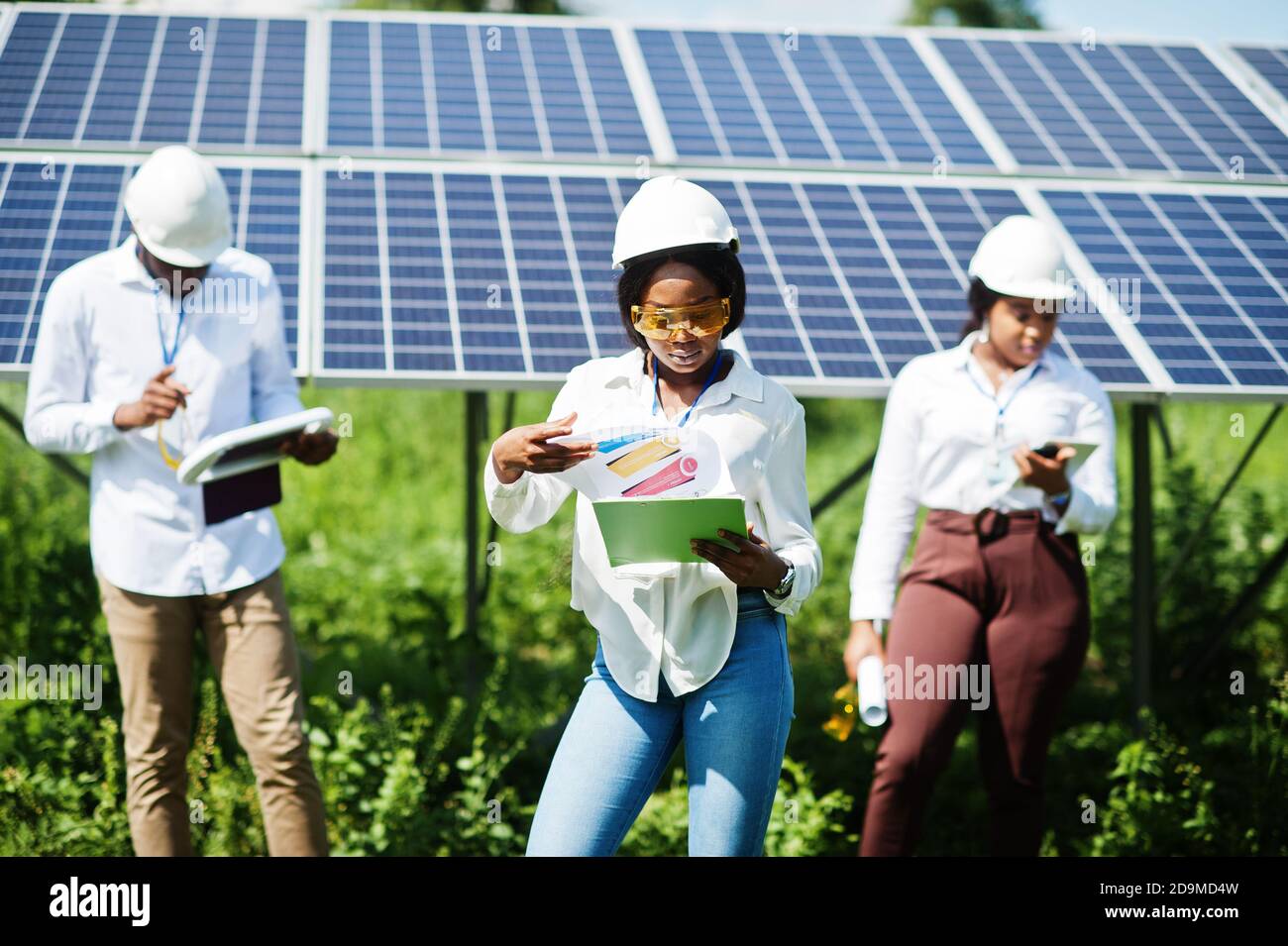 African american technician checks the maintenance of the solar panels ...