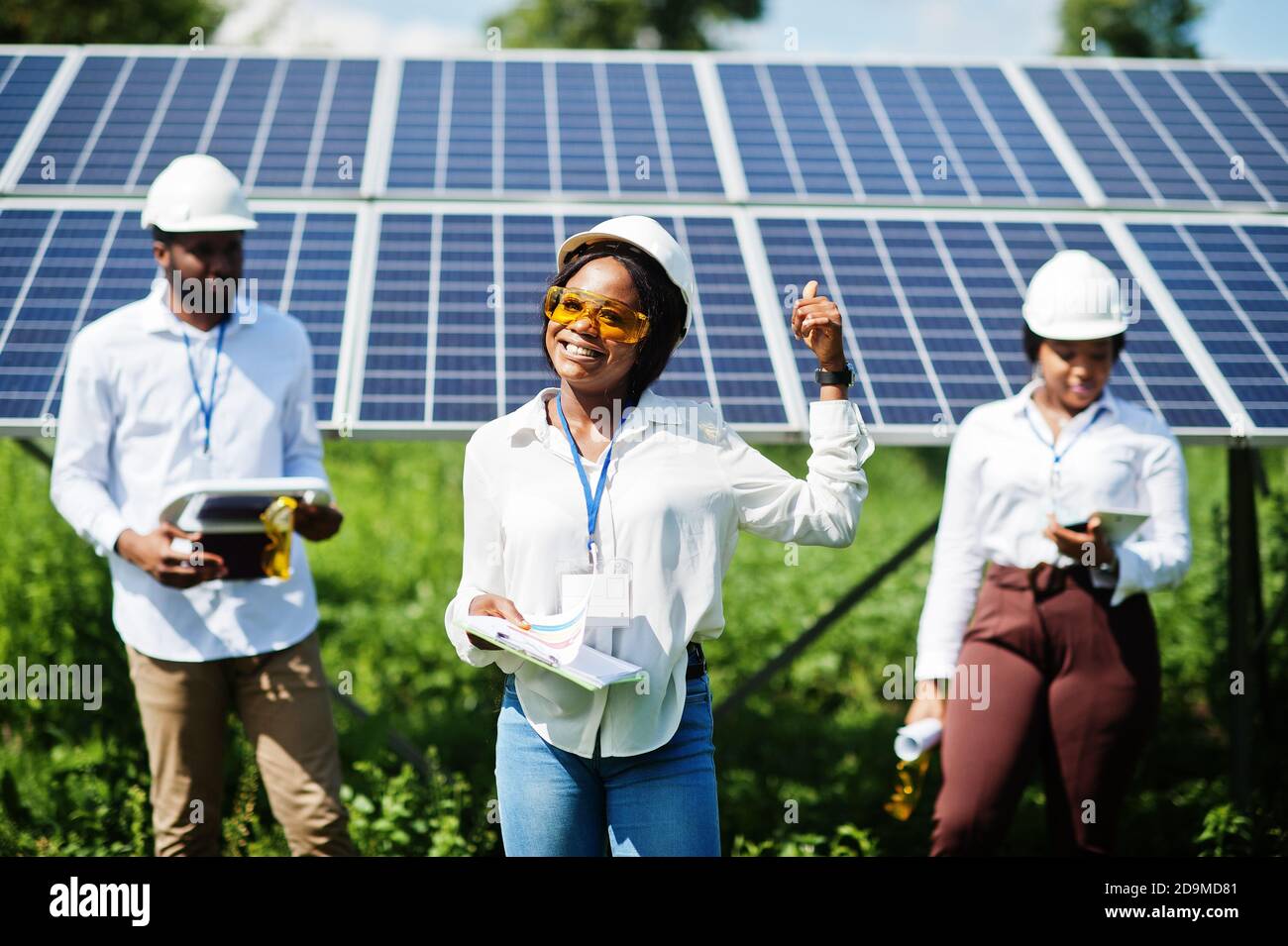 African american technician checks the maintenance of the solar panels ...