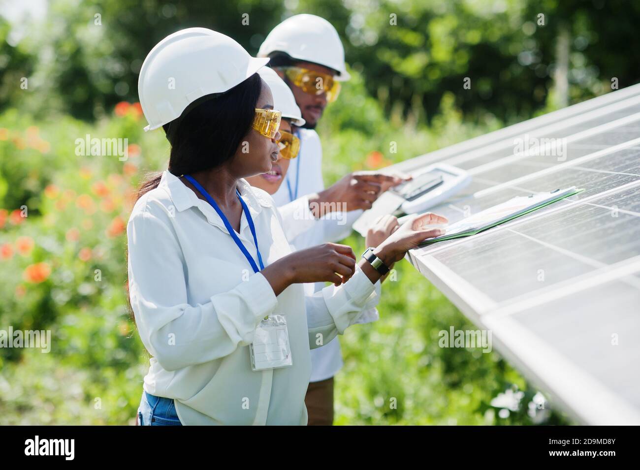African american technician checks the maintenance of the solar panels ...
