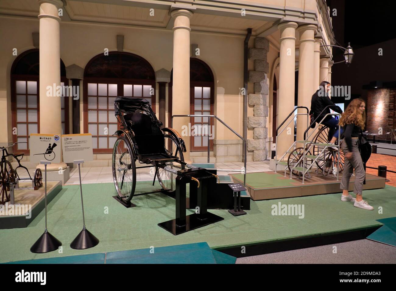 A rickshaw and bicycle display in front of the scale model of Choya ...