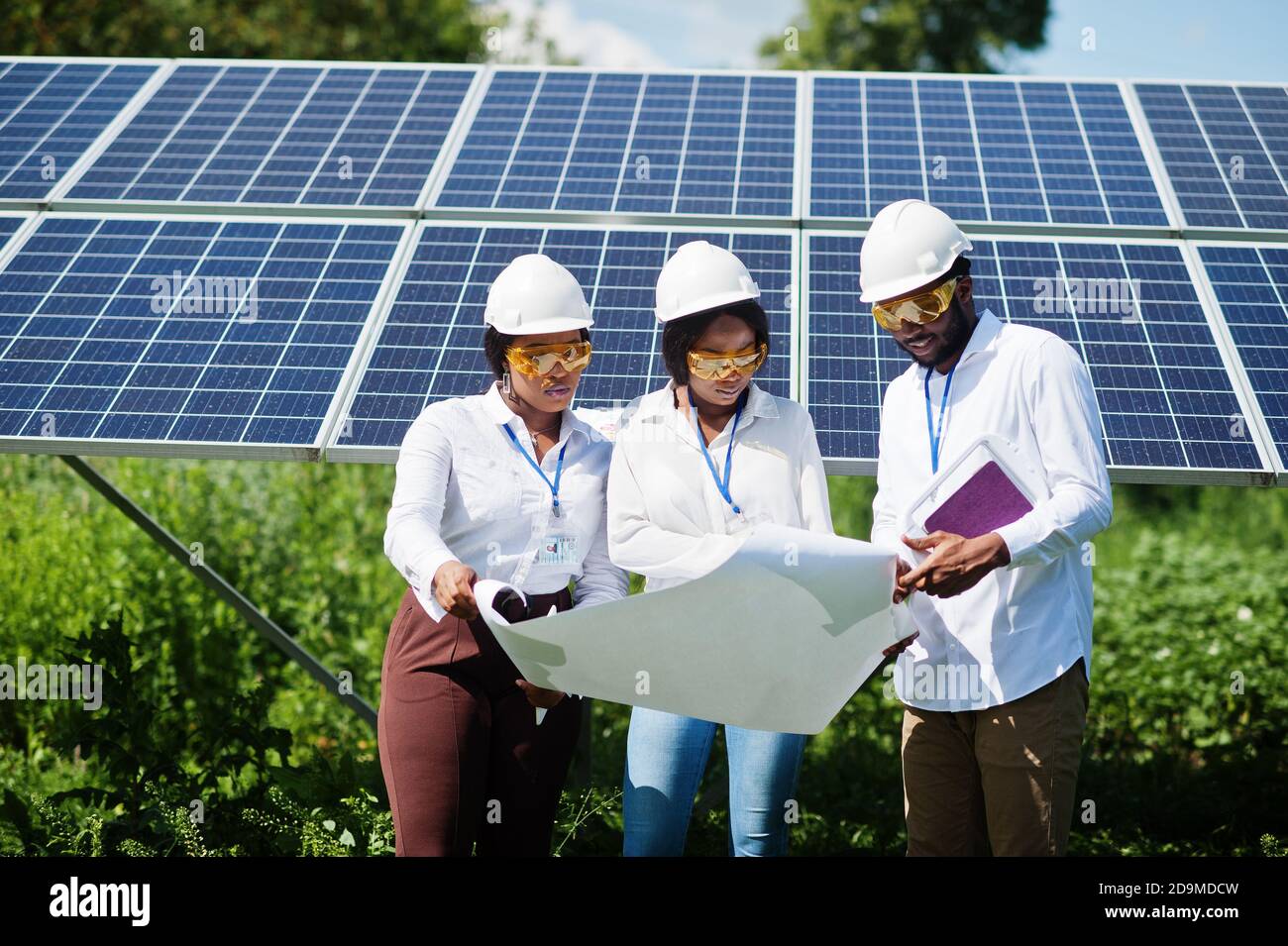 African american technician checks the maintenance of the solar panels ...